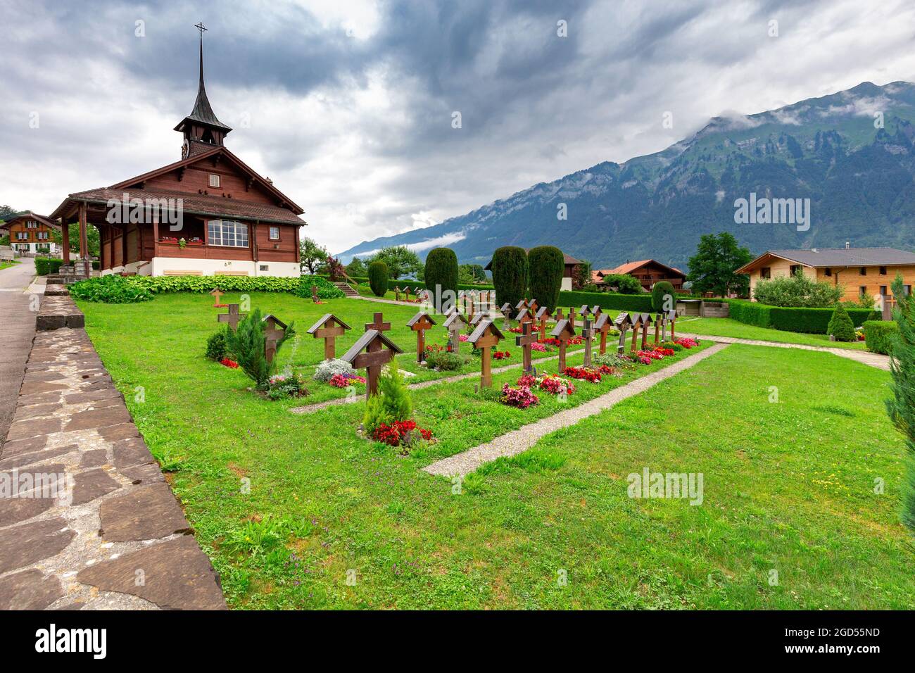 Church in the traditional Swiss village of Iseltwald on the famous lake ...
