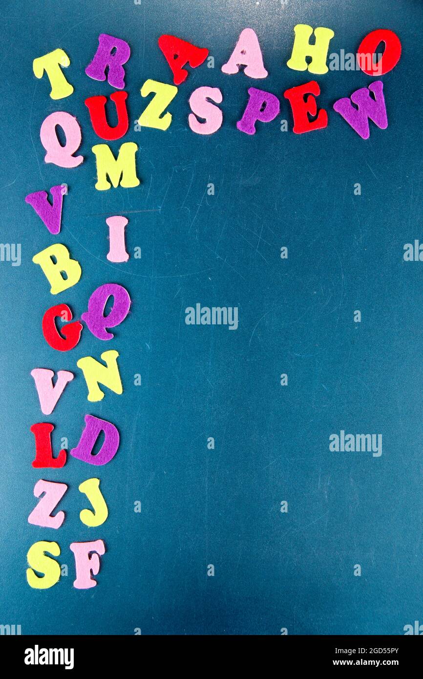 English alphabet on school desk background Stock Photo - Alamy