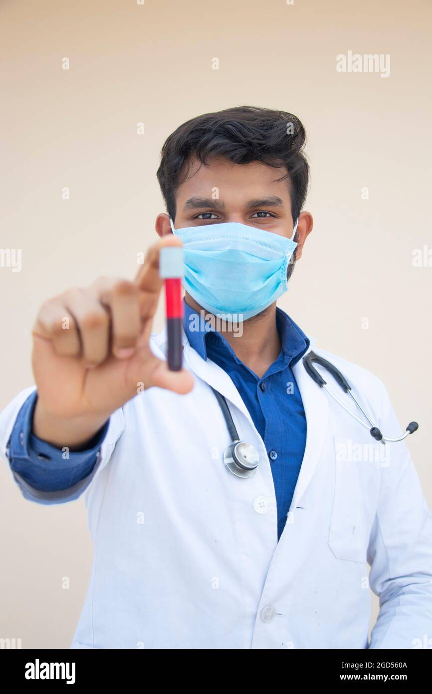 Laboratory assistant analyzing a blood sample Stock Photo - Alamy