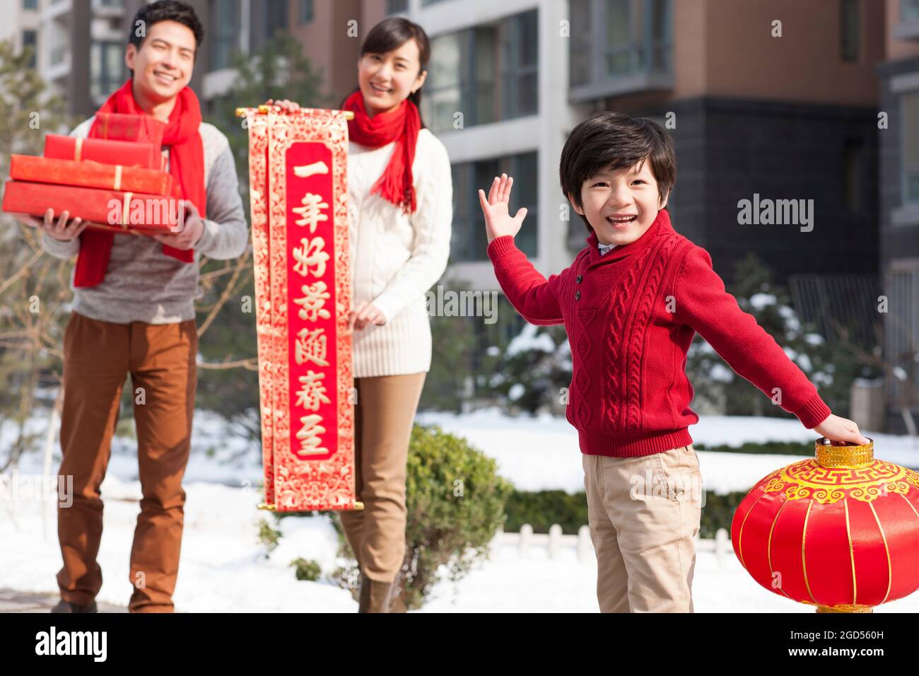 Cheerful family celebrating Chinese New Year Stock Photo - Alamy