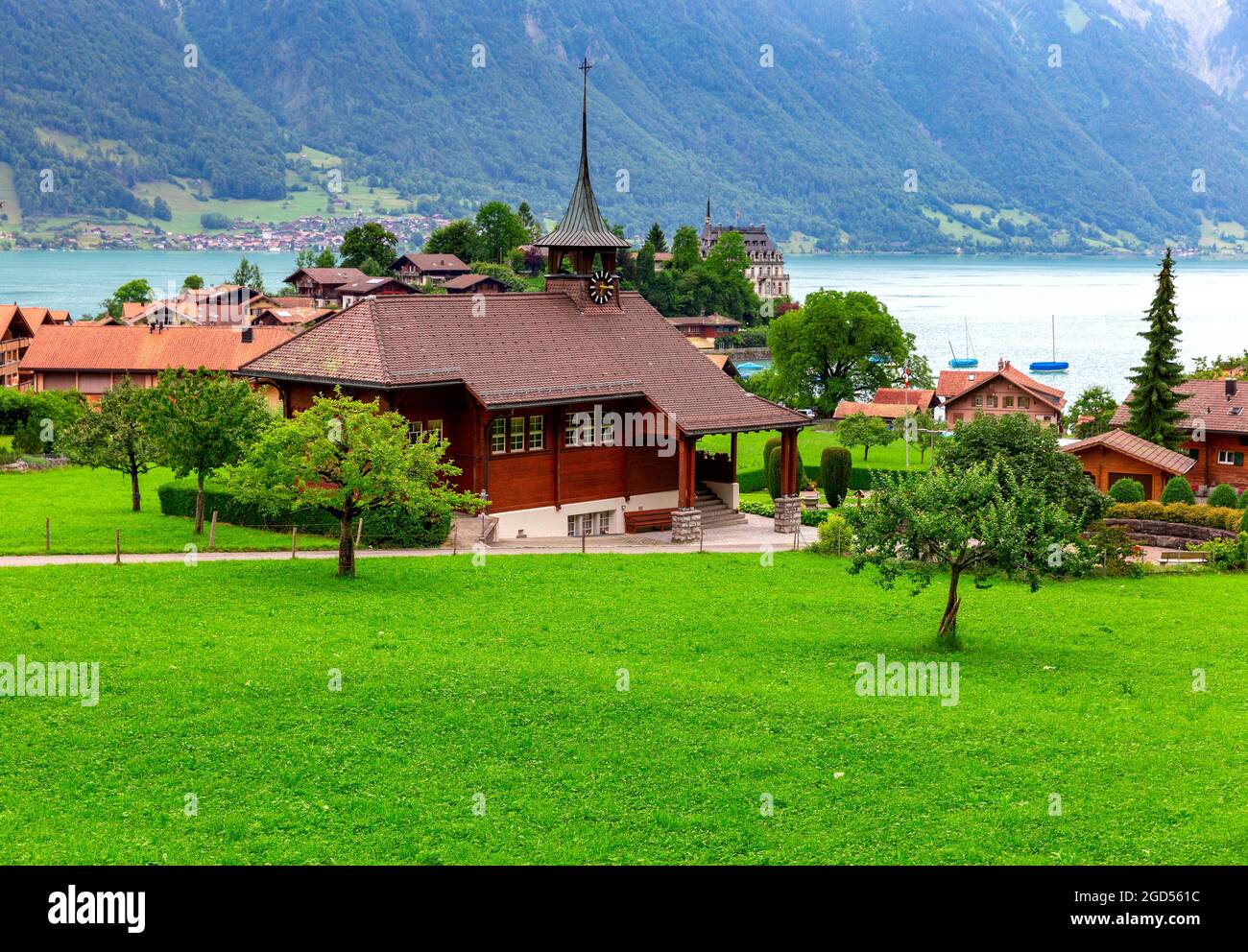 Church in the traditional Swiss village of Iseltwald on the famous lake ...