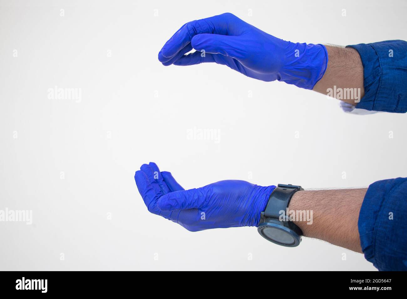 Human hands in medical gloves showing sign Stock Photo - Alamy