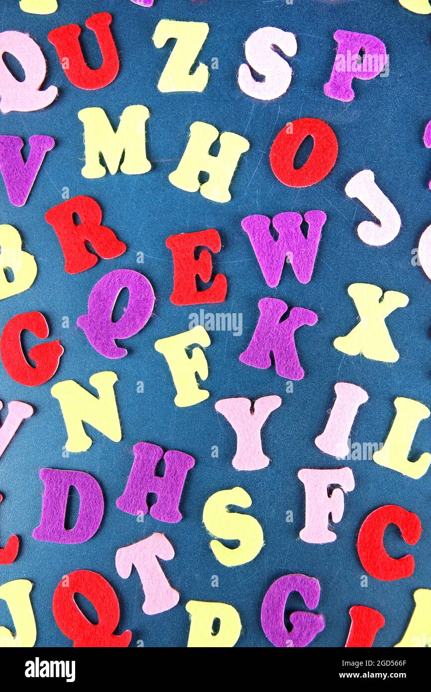 English alphabet on school desk background Stock Photo - Alamy