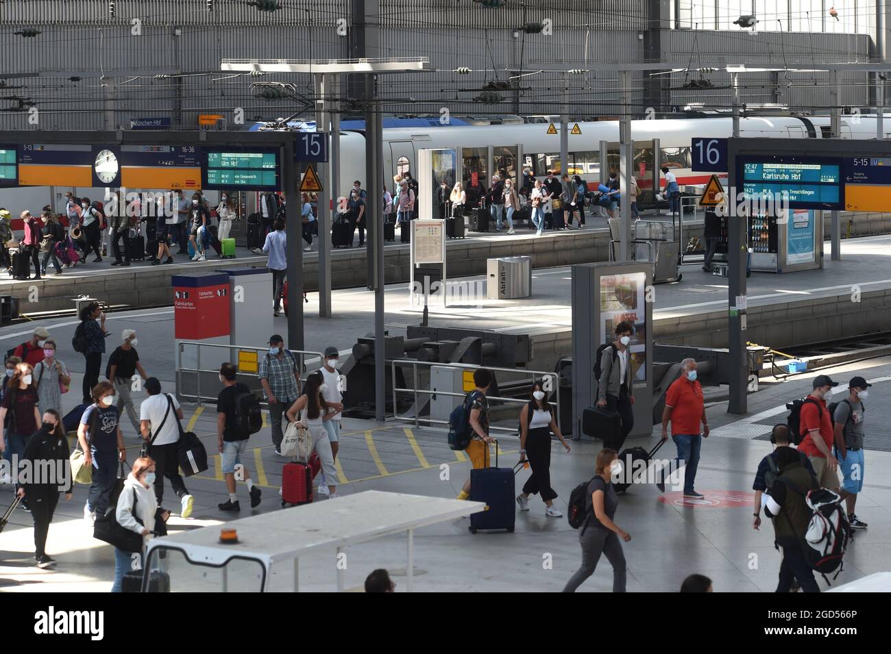Munich, Germany. 11th Aug, 2021. Passengers walk through the main ...