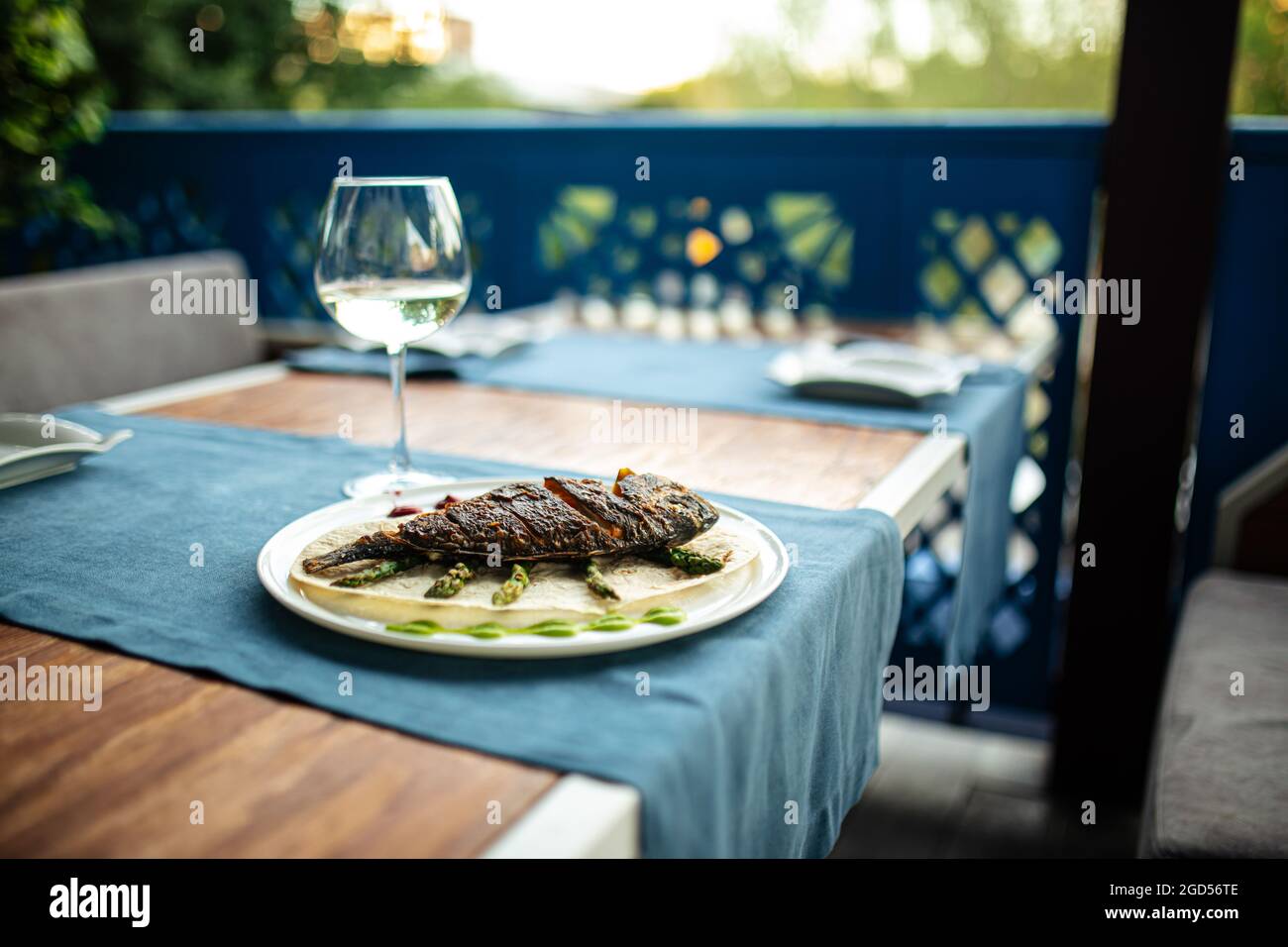 Dish of gourmet grilled dorada fish Stock Photo - Alamy