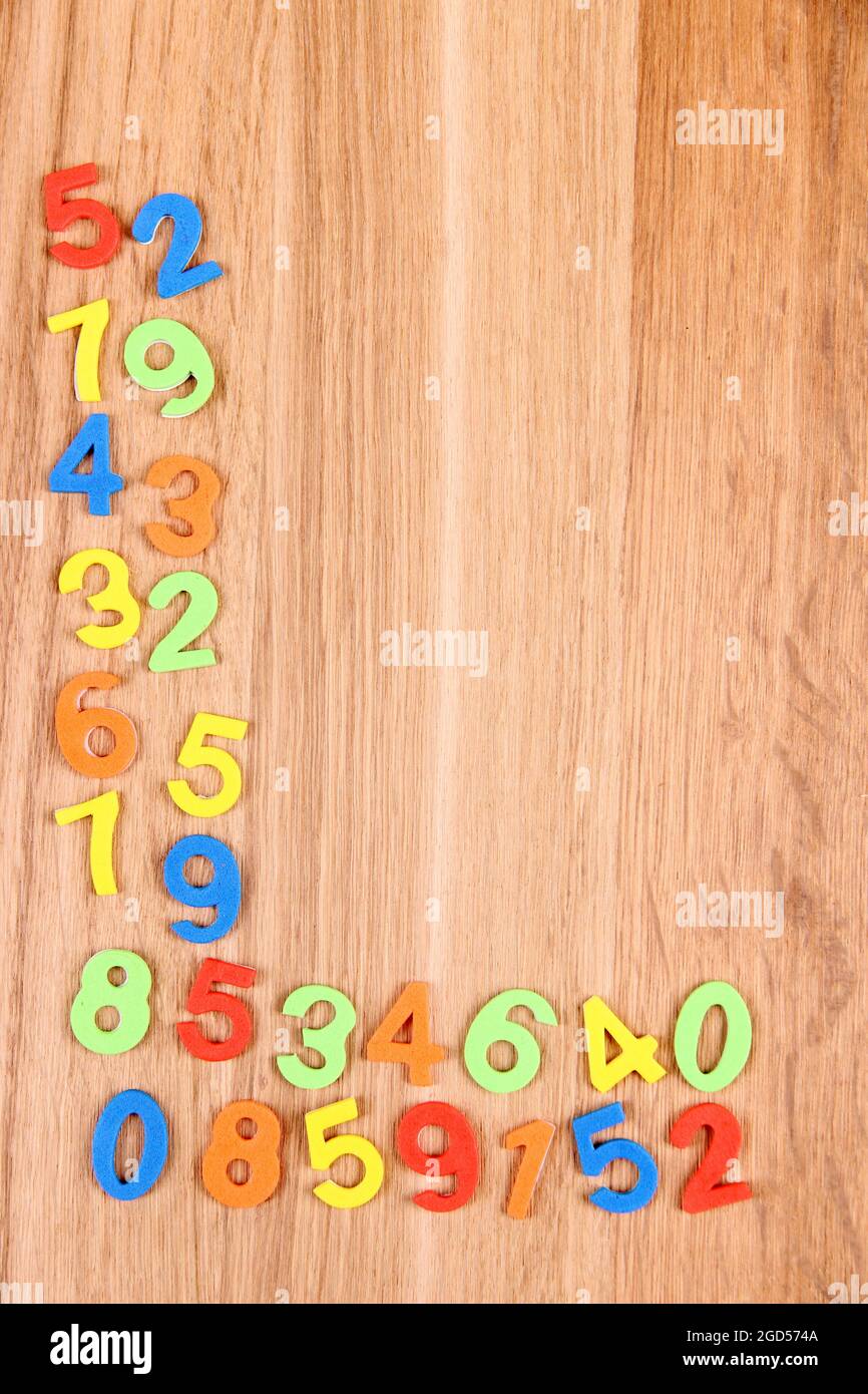 Colorful numbers on wooden background Stock Photo - Alamy