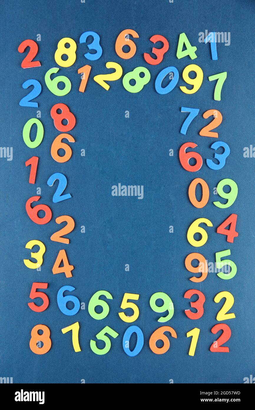 Colorful numbers on school desk background Stock Photo - Alamy