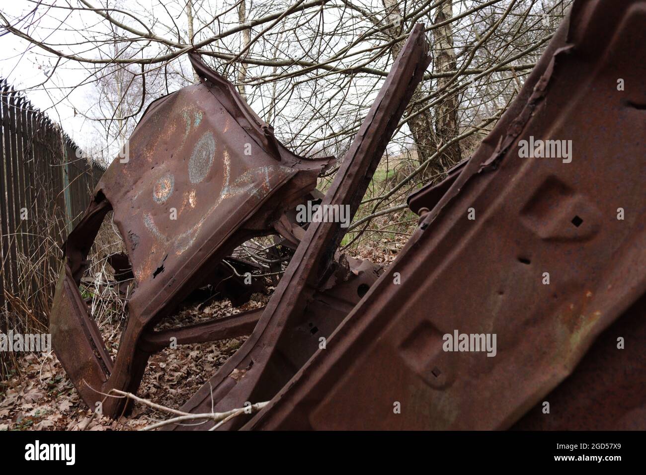 Abandoned, broken, rusting car body with smiley face drawn on Stock ...
