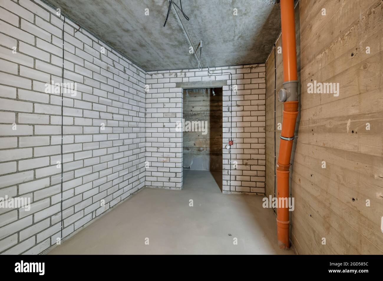 Empty basement room with minimal preparatory repairs. interior with ...