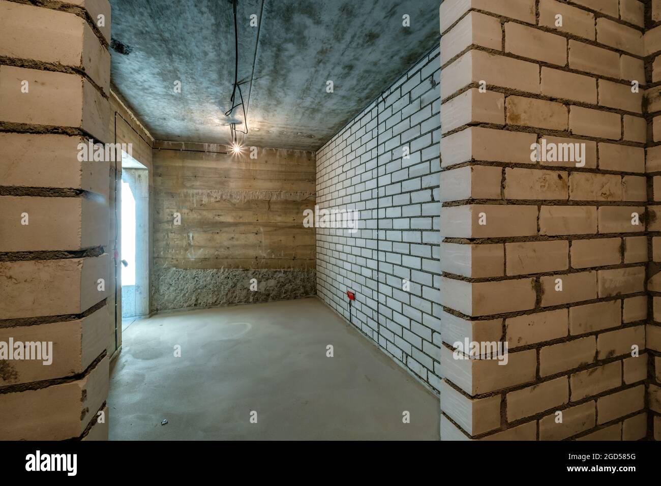 Empty basement room with minimal preparatory repairs. interior with ...