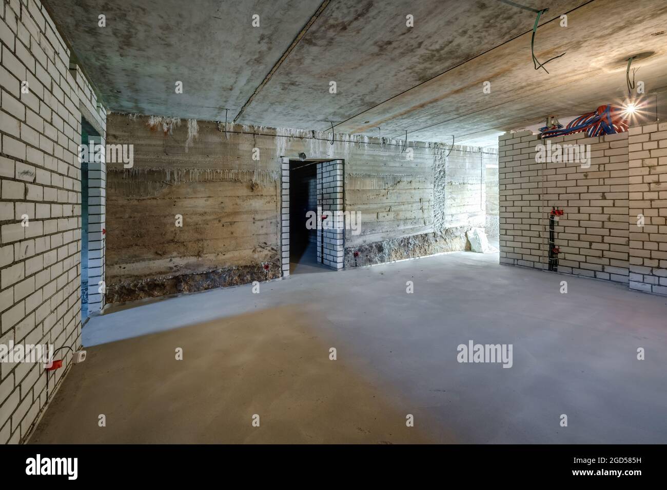 Empty basement room with minimal preparatory repairs. interior with ...