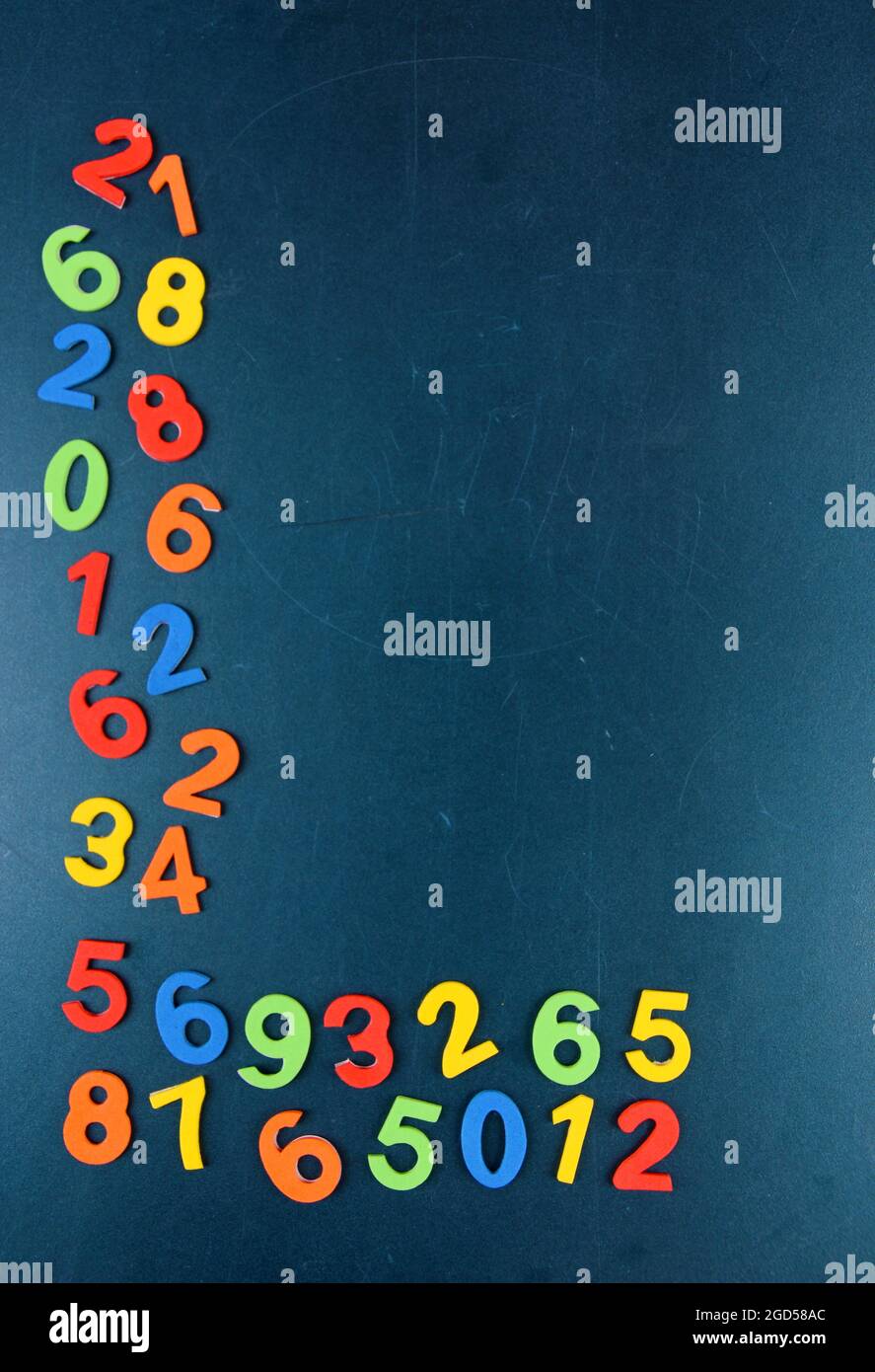 Colorful numbers on school desk background Stock Photo - Alamy