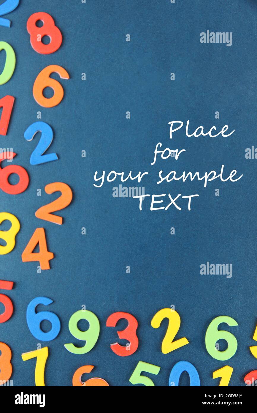 Colorful numbers on school desk background Stock Photo - Alamy