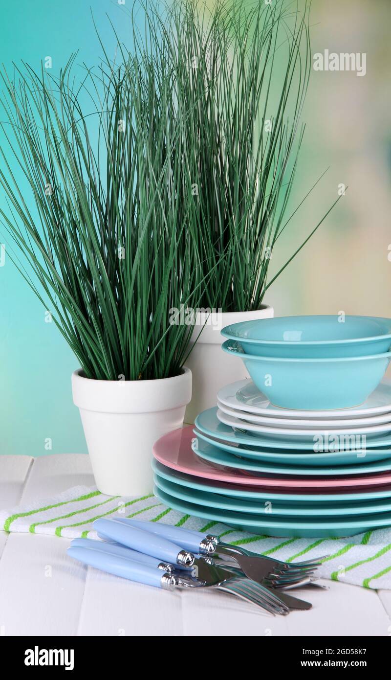 Clean dishes with flowers on wooden table on natural background Stock ...