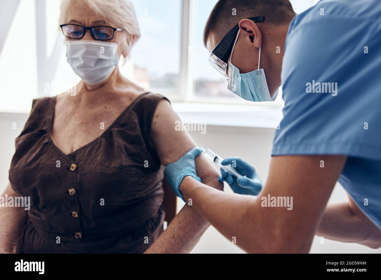 male doctor giving an injection immunization safety health care Stock ...