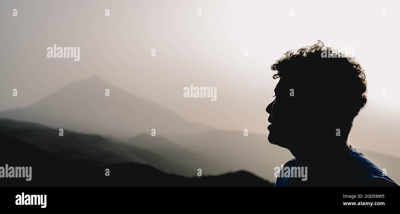 Silhouette of a man posing with sunset view in the background Stock ...