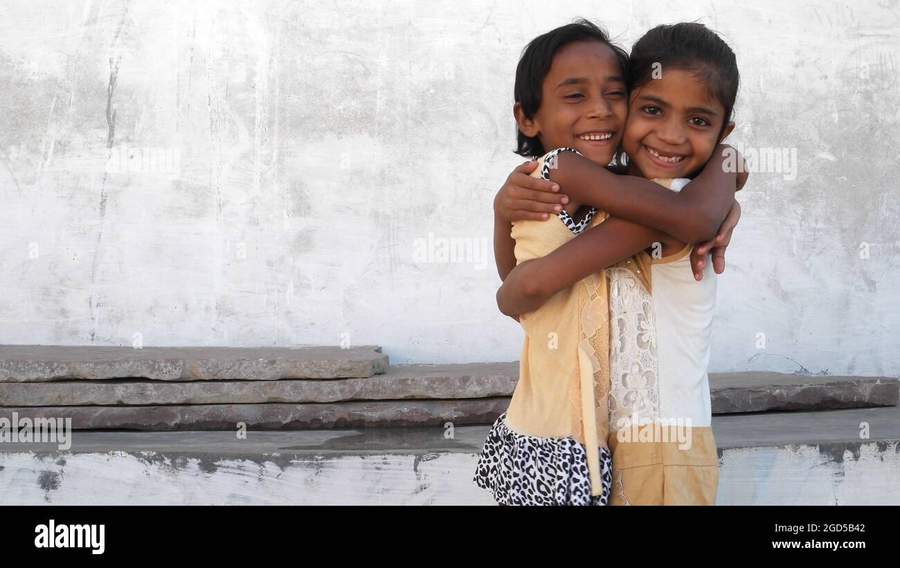 Closeup of two cute little girls hugging. India Stock Photo - Alamy