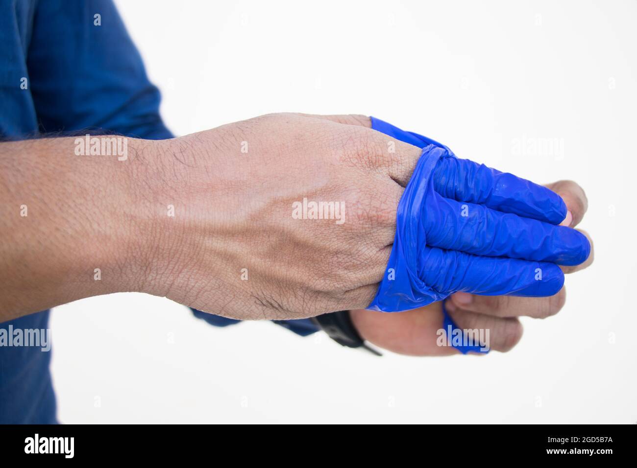 Close up Doctor removing gloves from his hand Stock Photo - Alamy
