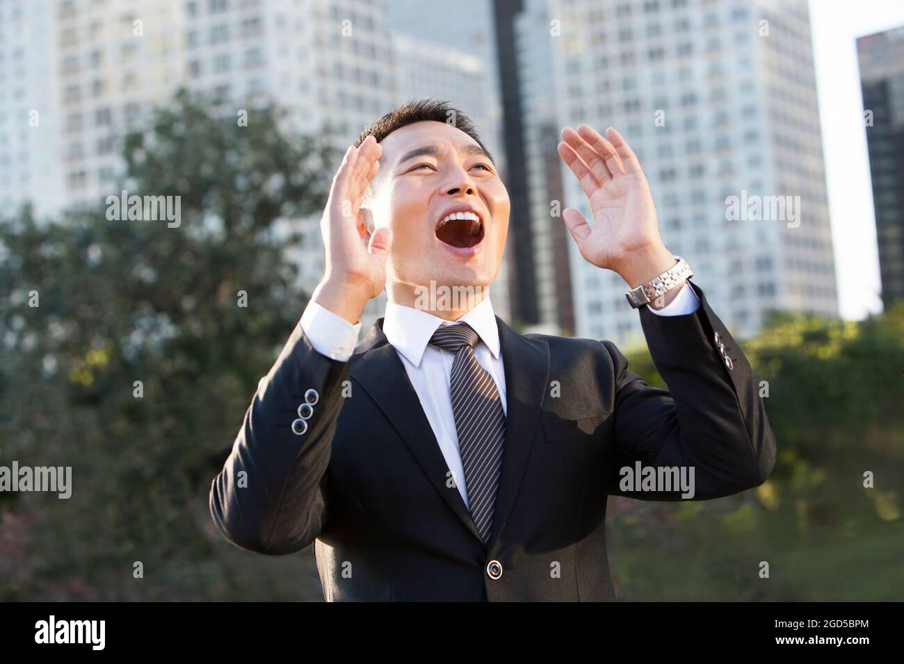 Businessman shouting with loud voice Stock Photo - Alamy