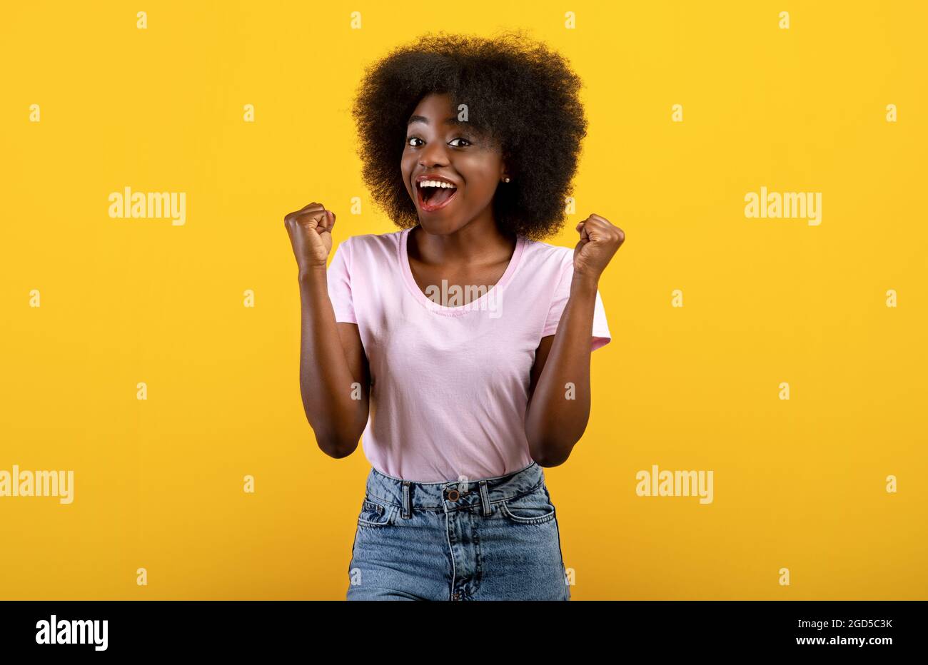 Positive african american lady gesturing YES, feeling excited and ...