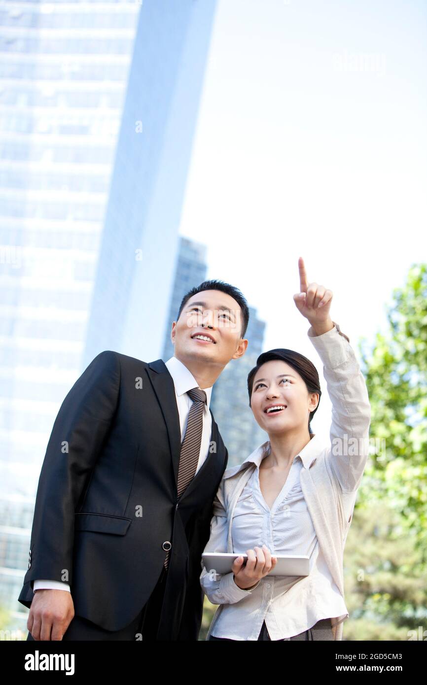 Office assistant pointing direction hi-res stock photography and images ...