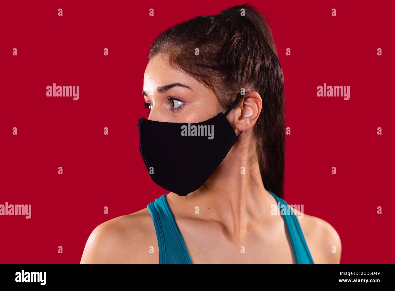 Close up photo of a nice young girl wearing the textile mask of black ...