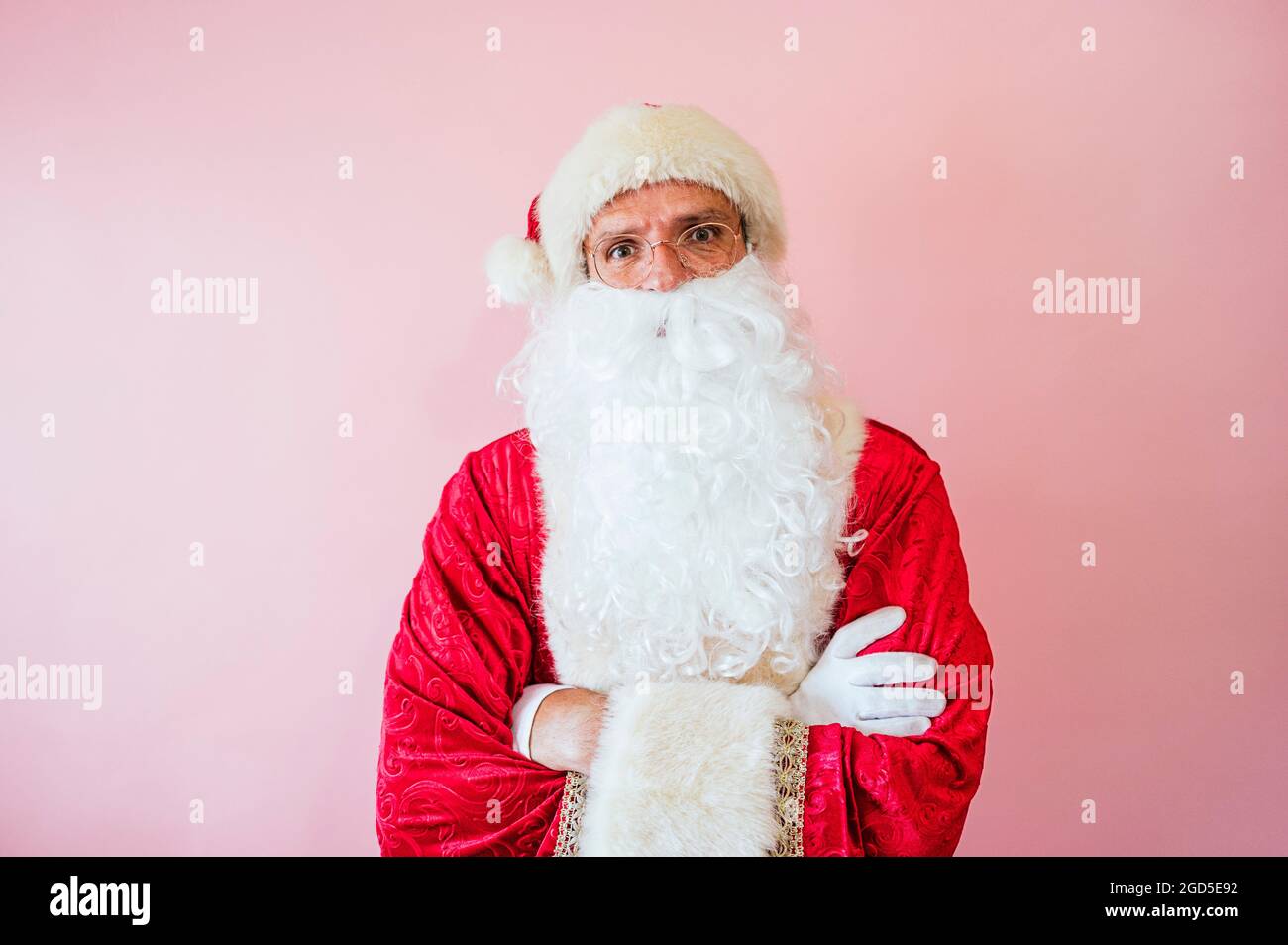 Man dressed as Santa Claus looking at camera Stock Photo - Alamy