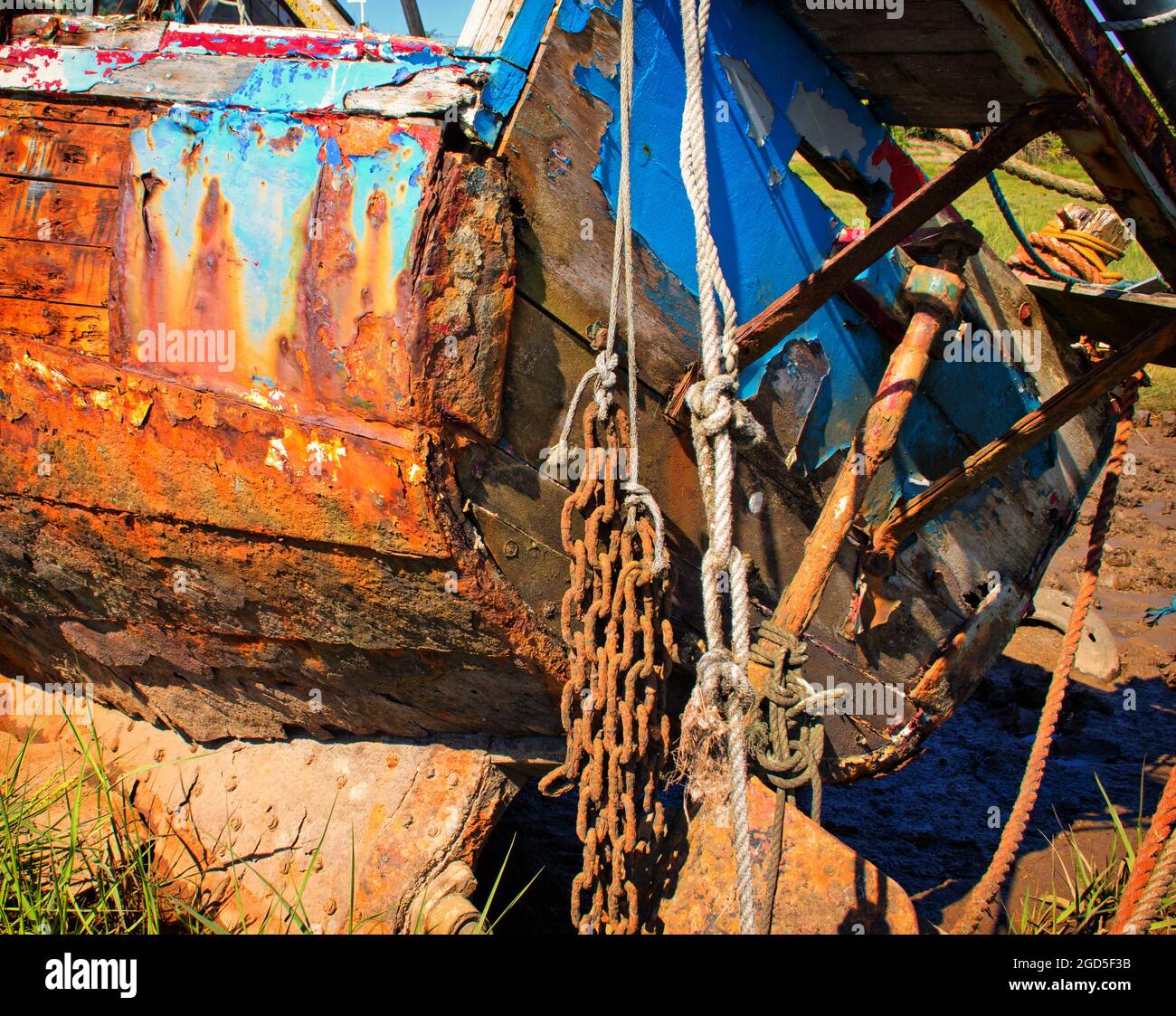 An abstract view of nautical decay. Chains and ropes hanging from a ...