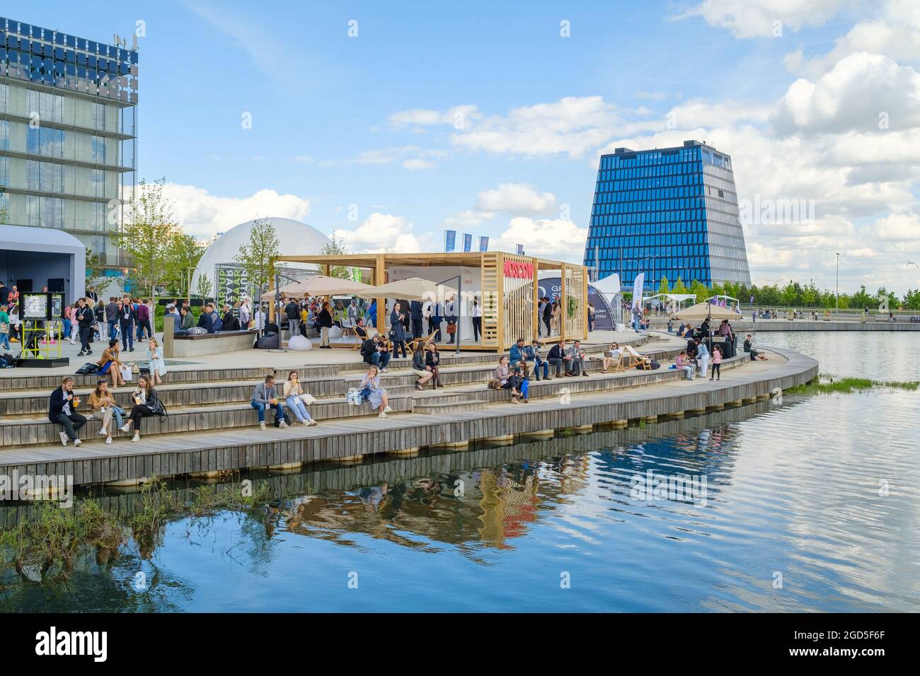 People gathering in park during business event Stock Photo - Alamy
