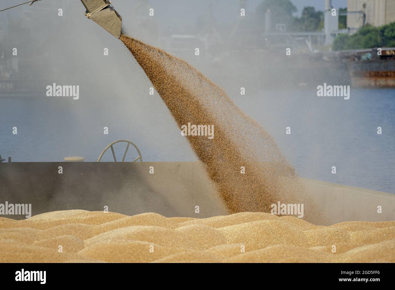 Machine pouring sand on a shore Stock Photo - Alamy