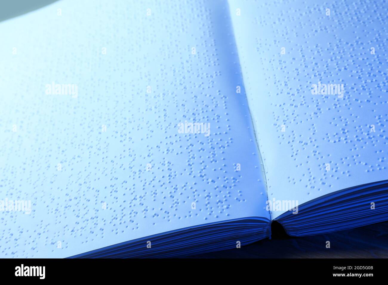 Book written in braille alphabet for blind people Stock Photo - Alamy