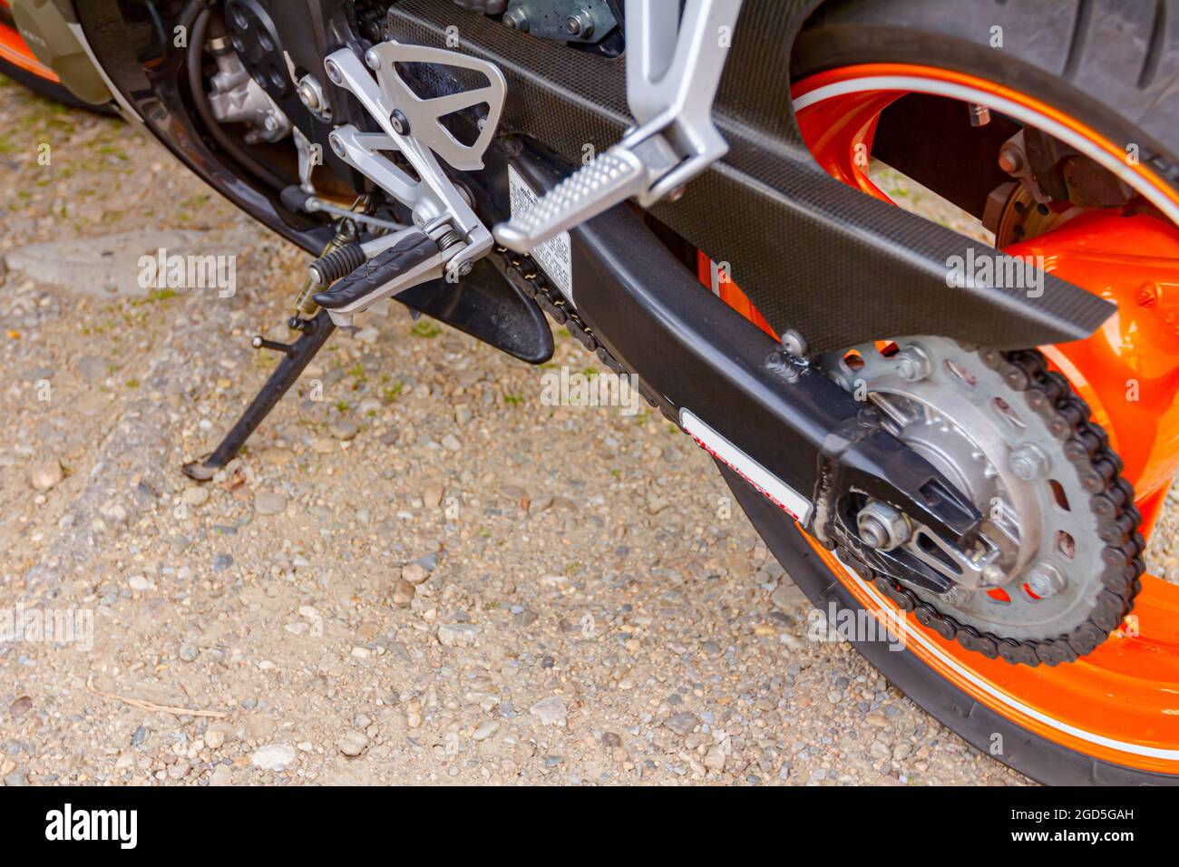 View on rear end of motorcycle gear wheel with chain back wheel Stock ...