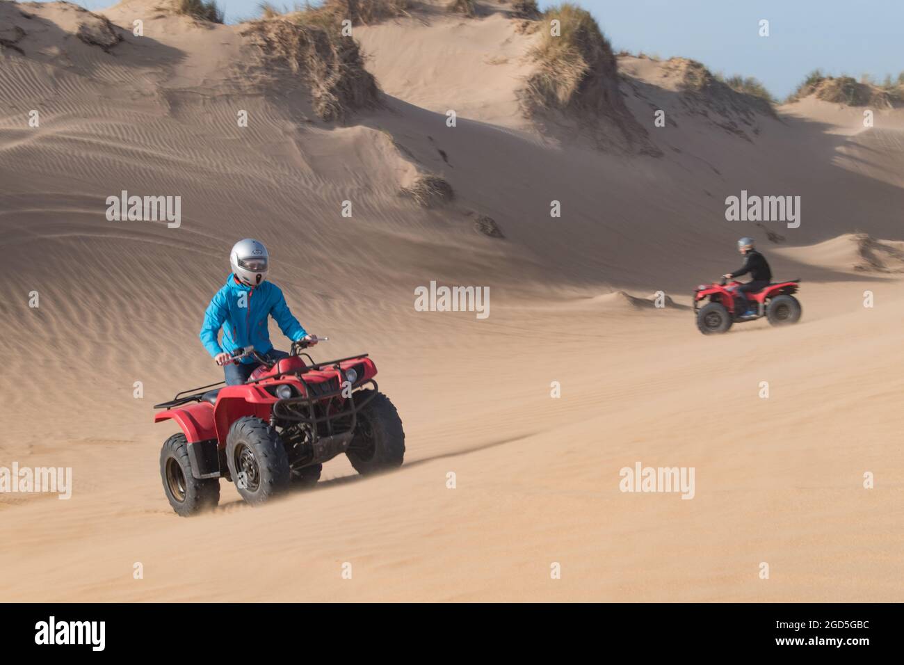 ESSAOUIRA, MOROCCO - Apr 01, 2017: A man driving a Quad Bike at the beach in Essaouira, Morocco ...