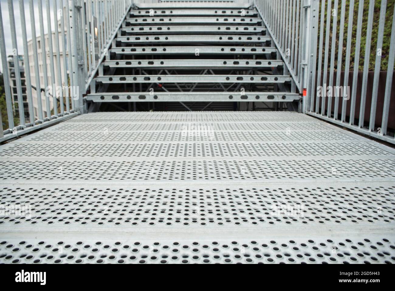 Perforated galvanised steel floor panels and stairs on scaffolding ...