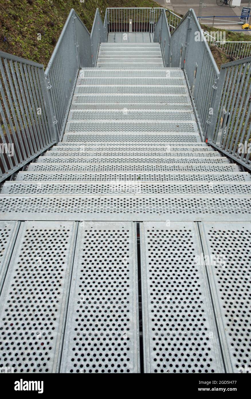 Perforated galvanised steel floor panels and stairs on scaffolding ...