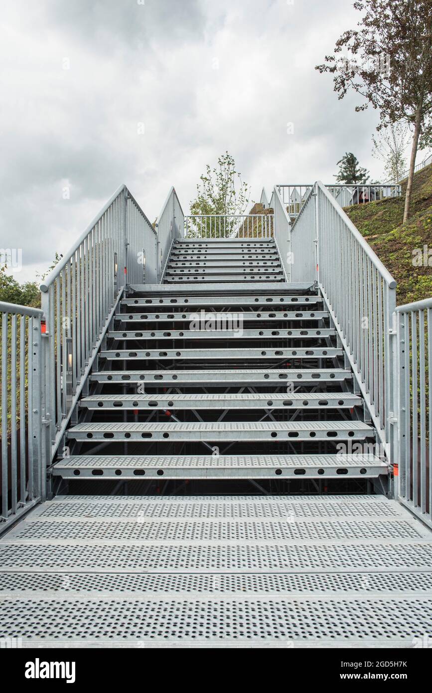 Perforated galvanised steel floor panels and stairs on scaffolding ...