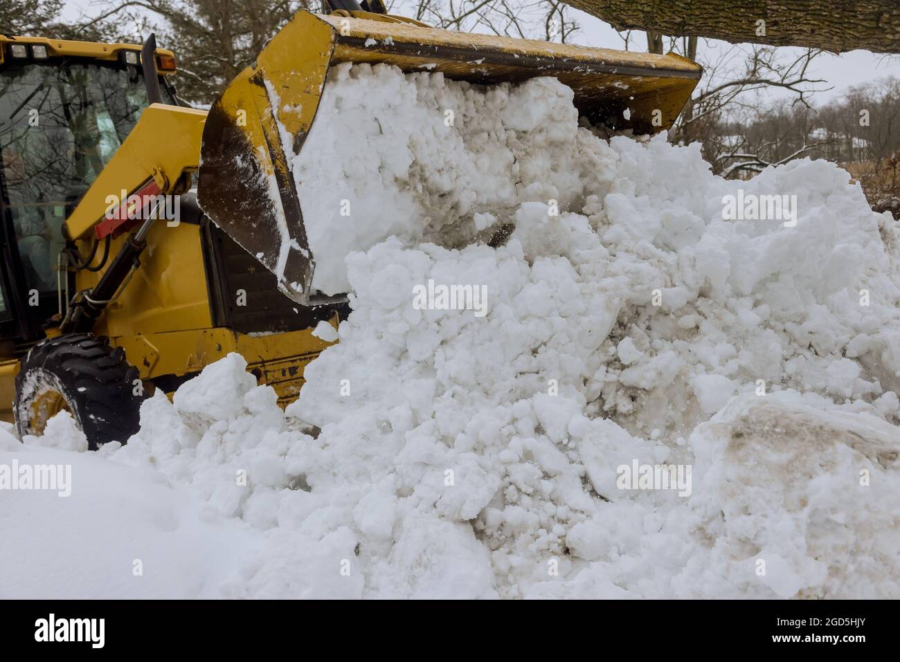 Large snow drift white snow pile lumps on road Stock Photo - Alamy