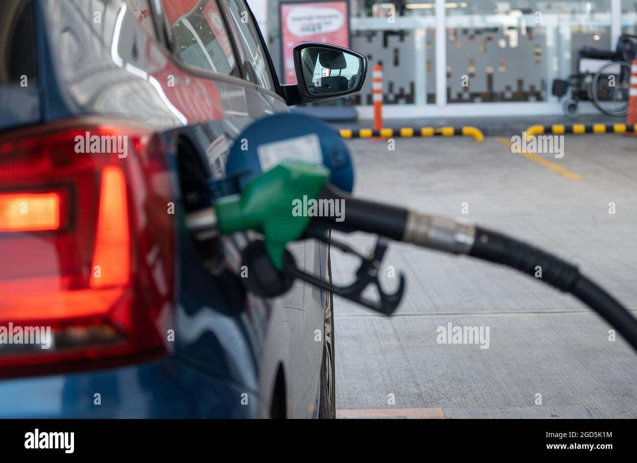 Fuel up the blue car in the gas station, fulling the oil Stock Photo ...