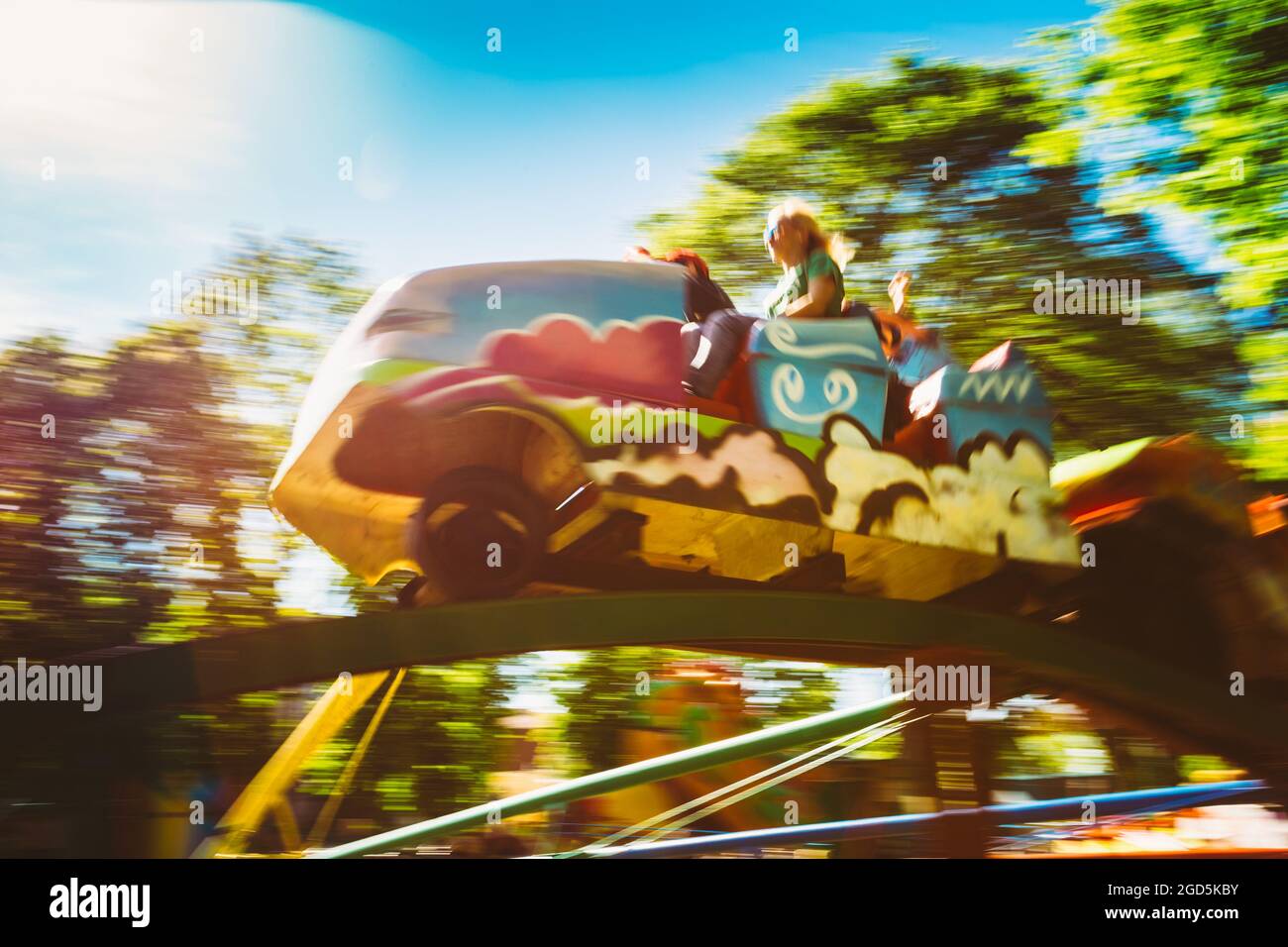 People Having Fun On Rollercoaster In The Park Stock Photo - Alamy