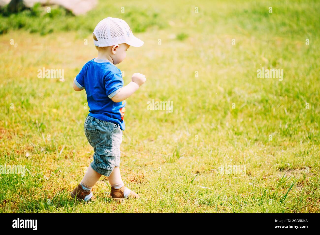 Happy Little Boy Child Running On Summer Green Grass Meadow Stock Photo ...