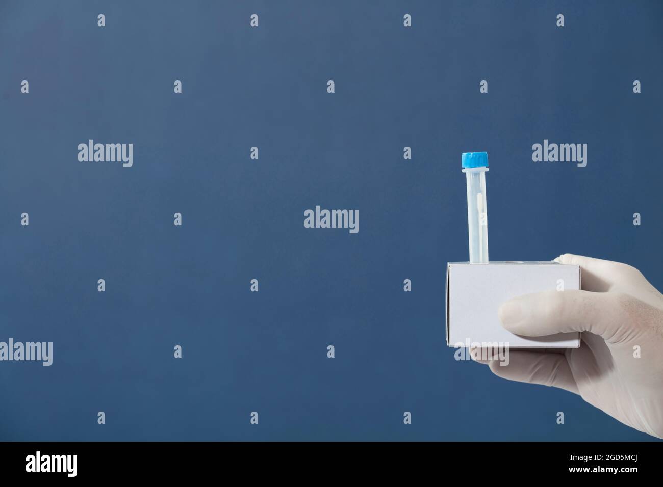 nurse's hands with surgical gloves, medium transport tubes for pcr ...