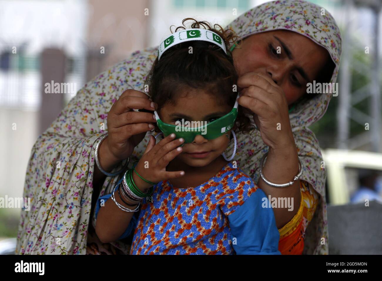 Pakistani Baby With Flag Pakistan Flag In Hand. Children Holding Flag.