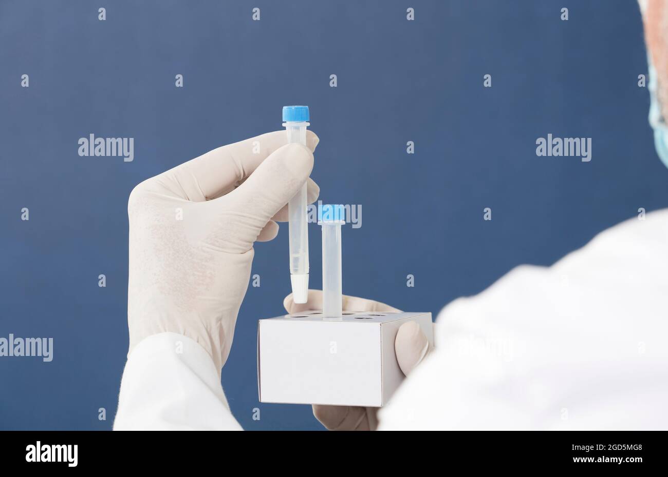 coronaviris pcr kit in the hands of a doctor with surgical gloves ...