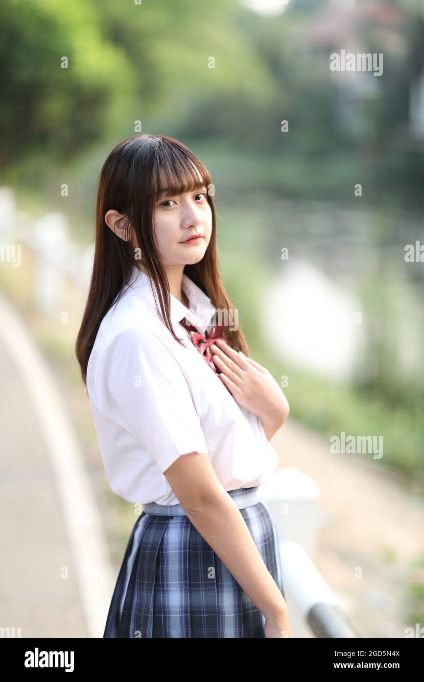 Beautiful Asian Japanese School Girl Uniform Looking At Park Outdoor