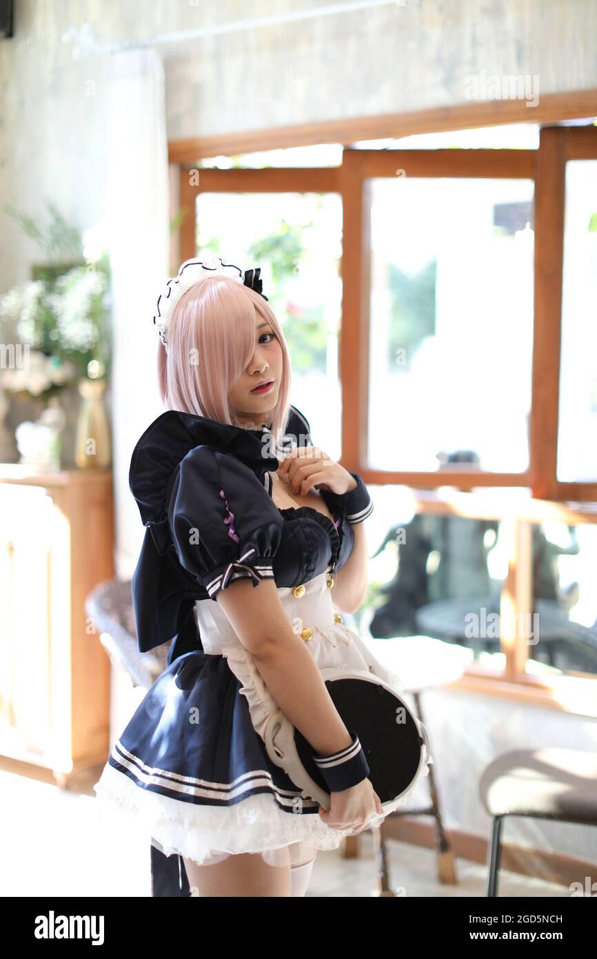 Portrait Of Girl With Japanese Maid Costume In Vintage Restaurant Stock