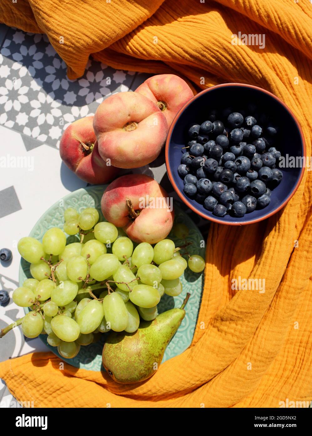 Still life with fruits and berries. Organic berries and fruits on a ...