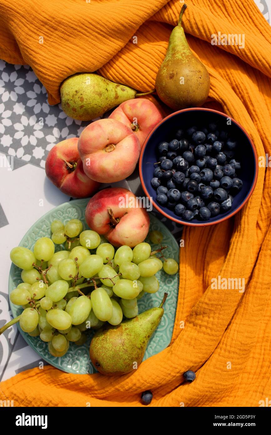 Still life with fruits and berries. Organic berries and fruits on a ...
