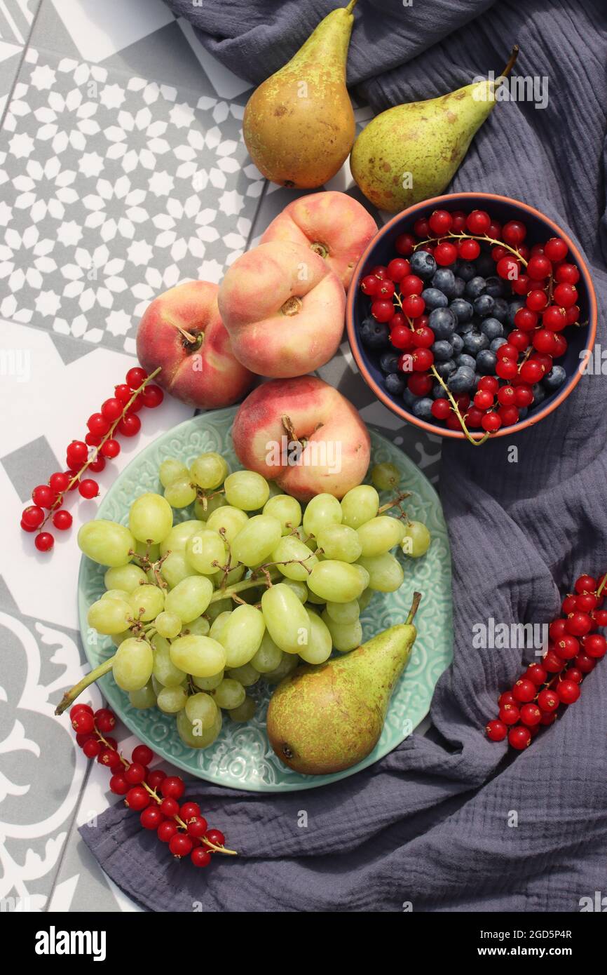 Still life with fruits and berries. Organic berries and fruits on a ...