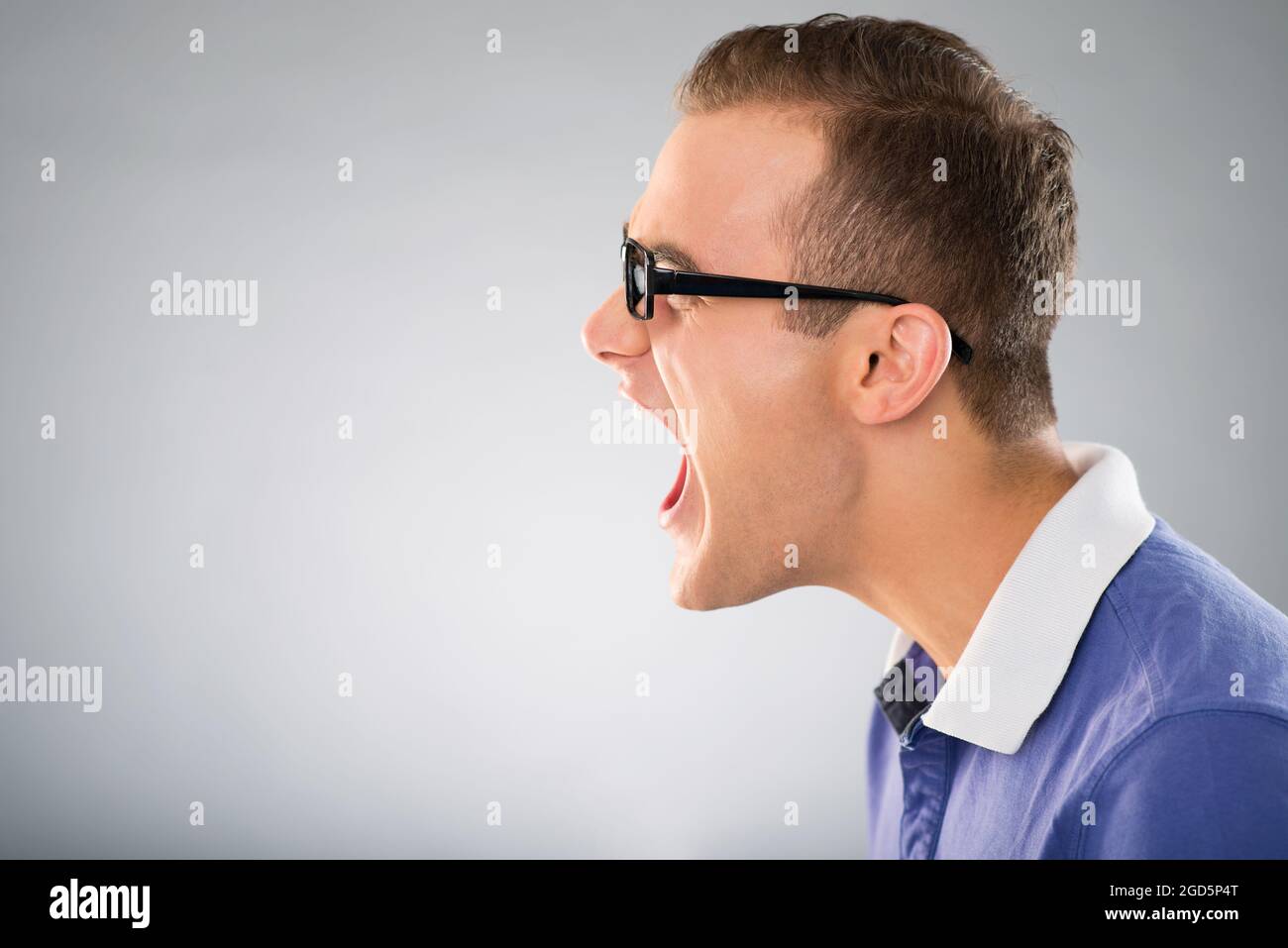 Profile of a furious man Stock Photo - Alamy