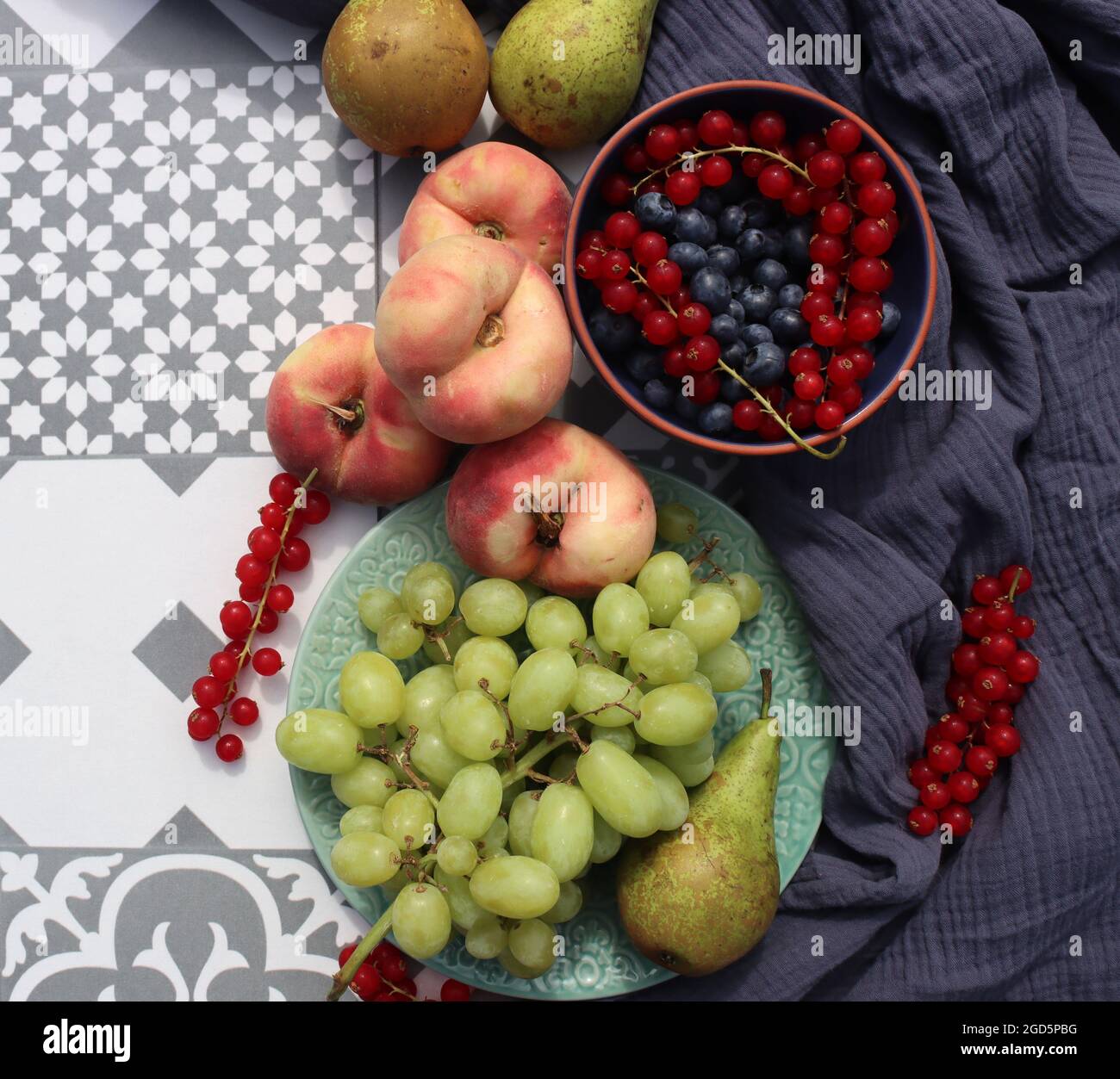 Beautiful summer berries and fruits on a table. Top view photo of ...